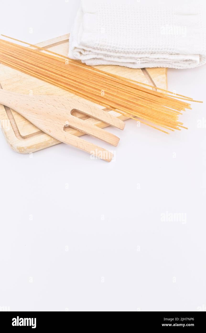 italian spaghetti package from organic farming on a wooden chopping ...
