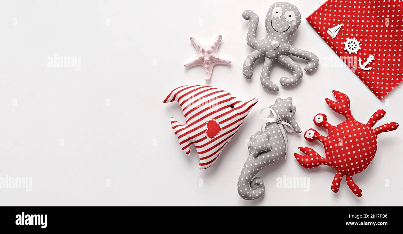 Handmade cartoon stuffed toys in hand, sea life octopus, crab, fish and ...