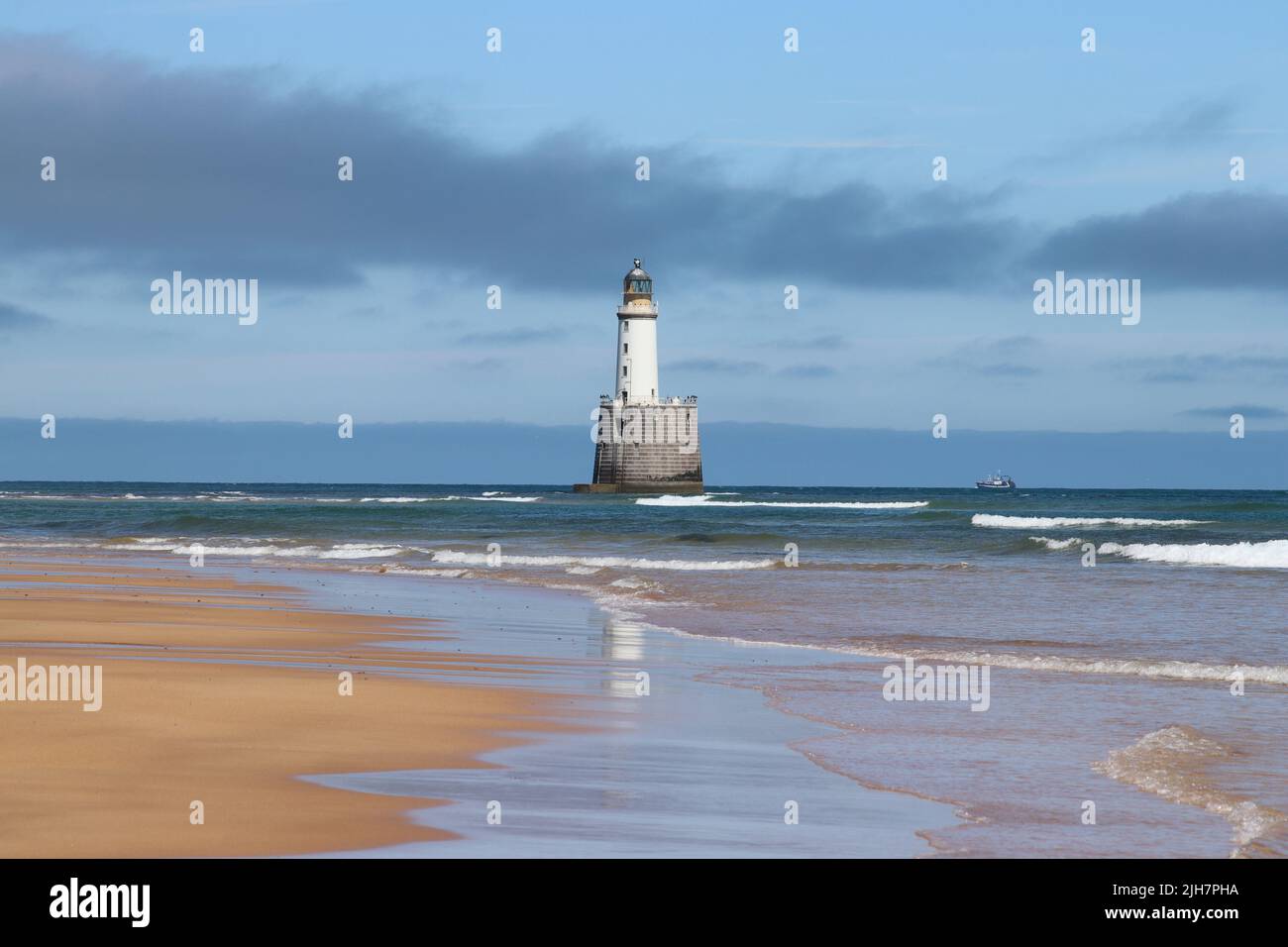 White lighthouse on platform in sea Stock Photo - Alamy