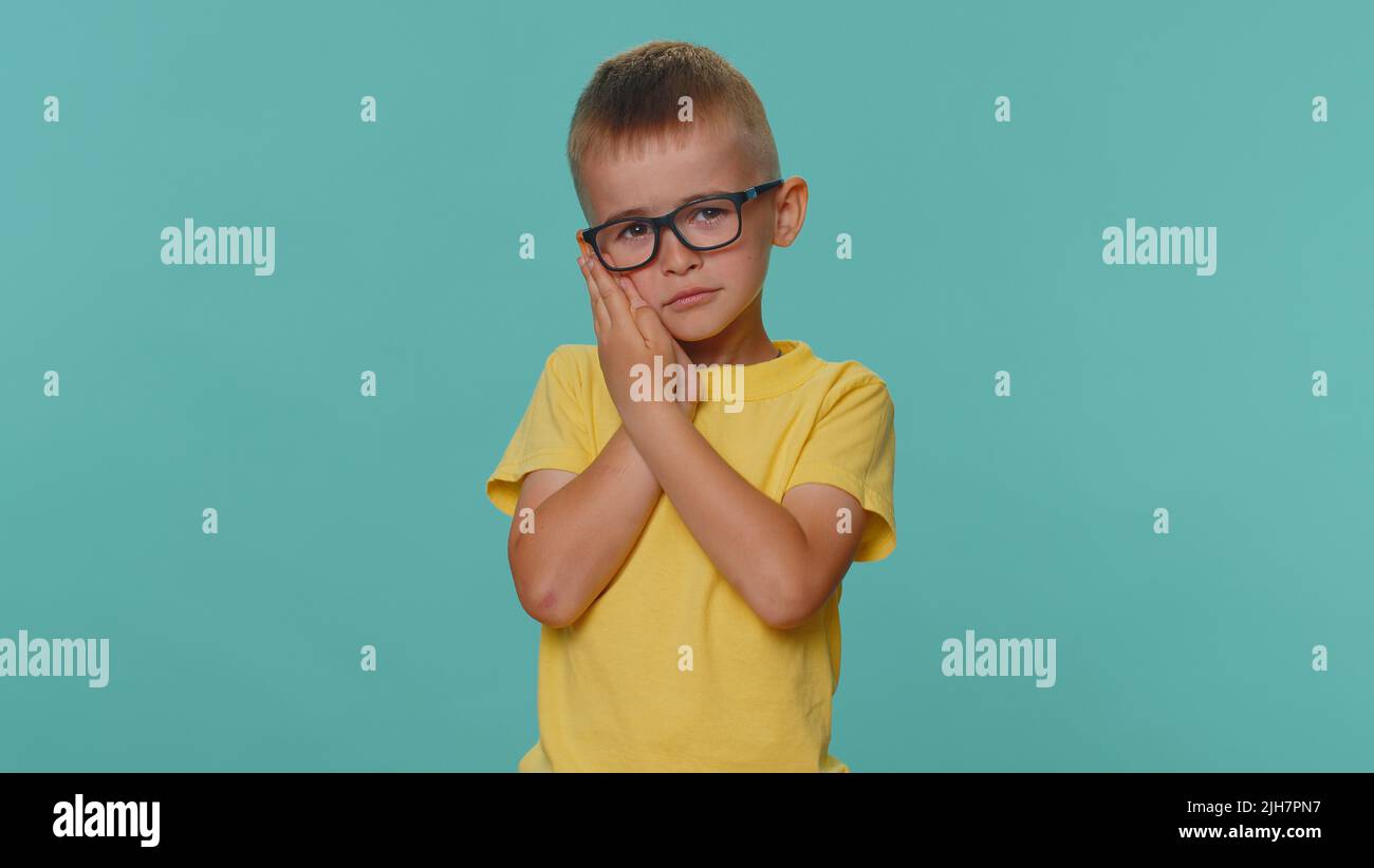 Dental problem. Little toddler children boy touching cheek, closing ...