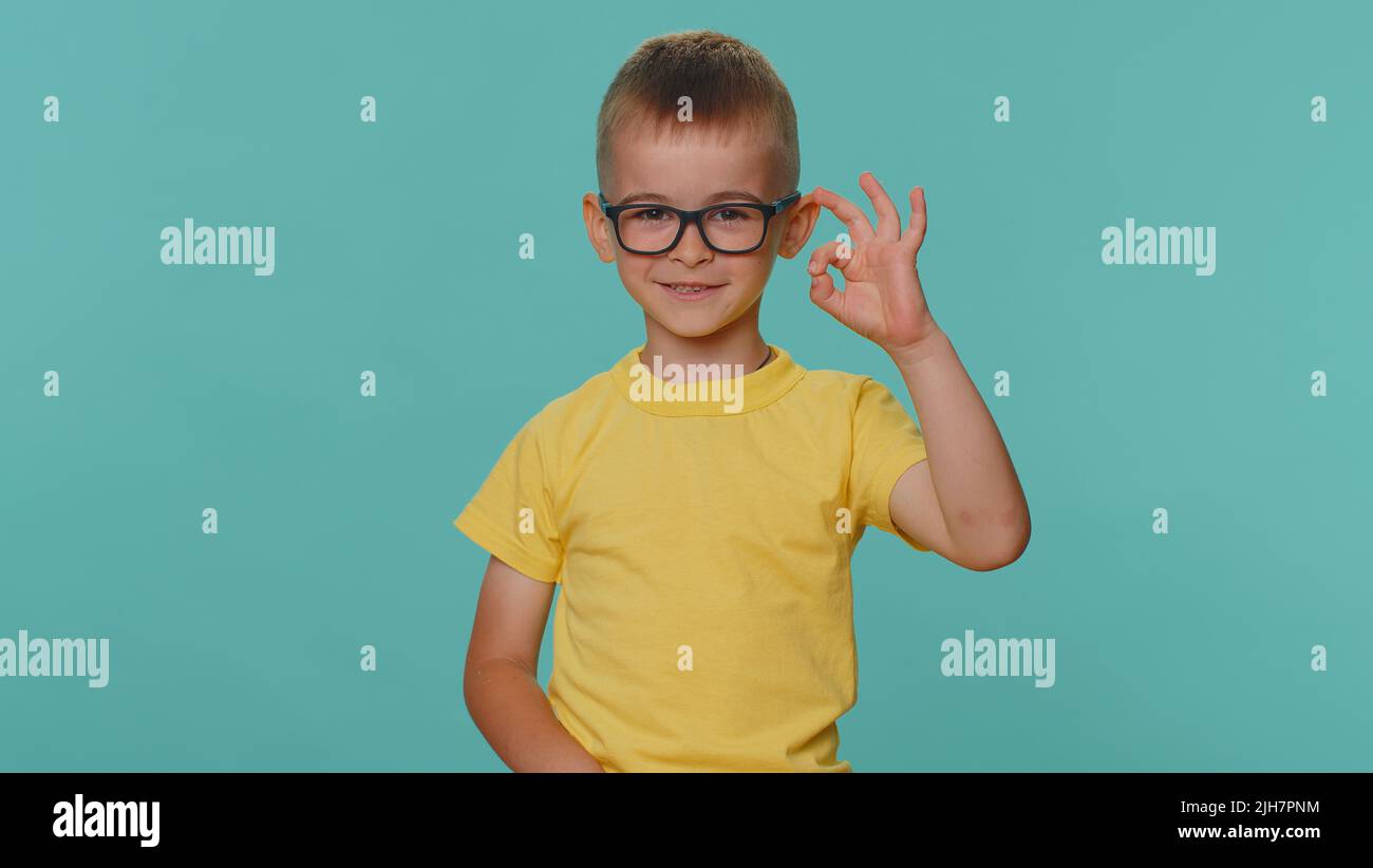 Ok. Little toddler children boy looking approvingly at camera showing ...