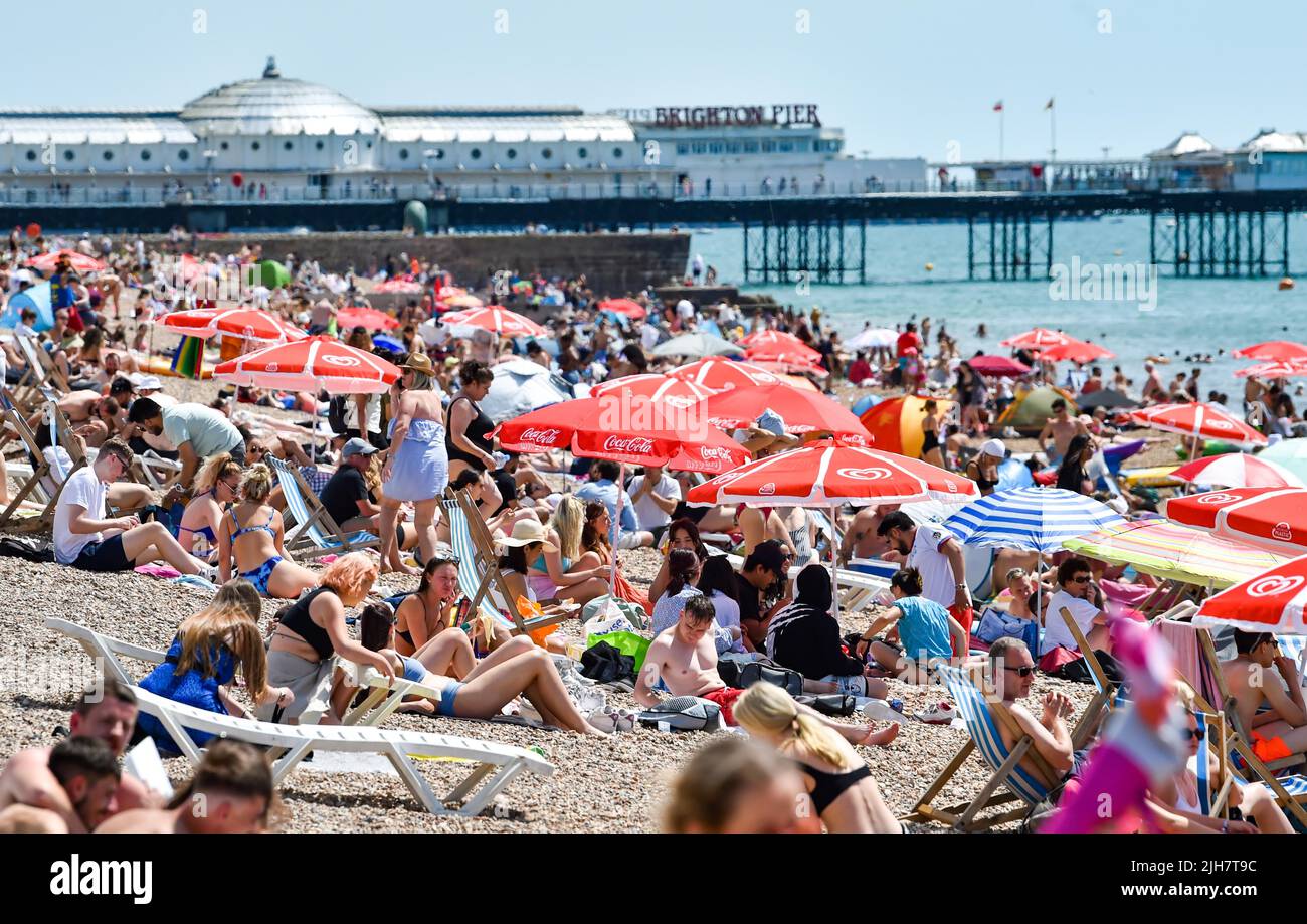 Brighton UK 16th July 2022 - Brighton beach is packed as crowds enjoy ...