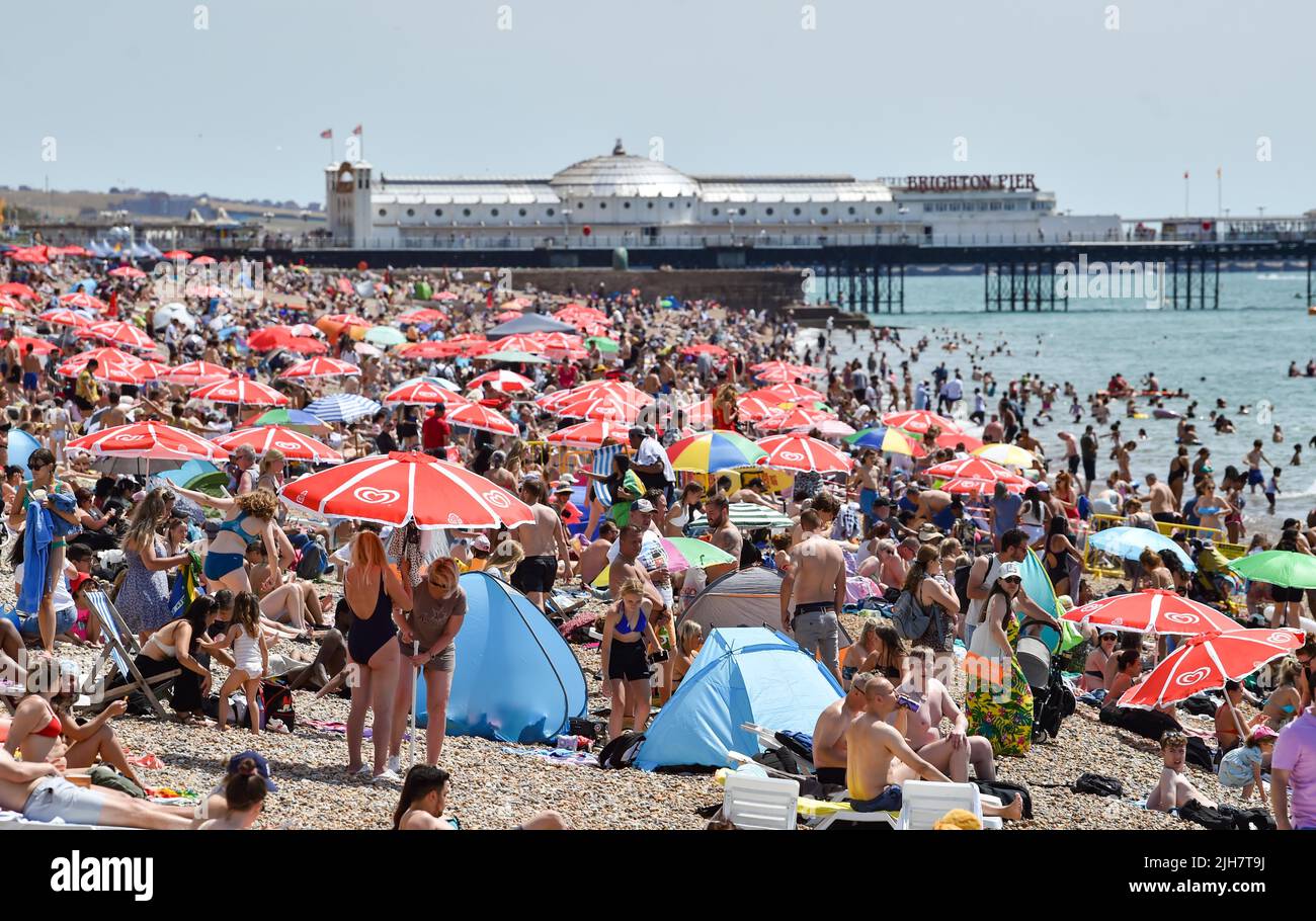 Brighton UK 16th July 2022 - Brighton beach is packed as crowds enjoy ...
