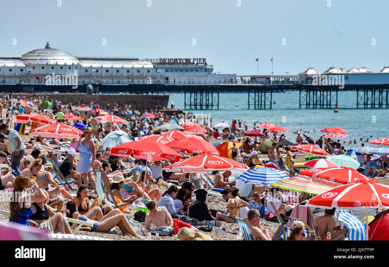 Brighton UK 16th July 2022 - Brighton beach is packed as crowds enjoy ...