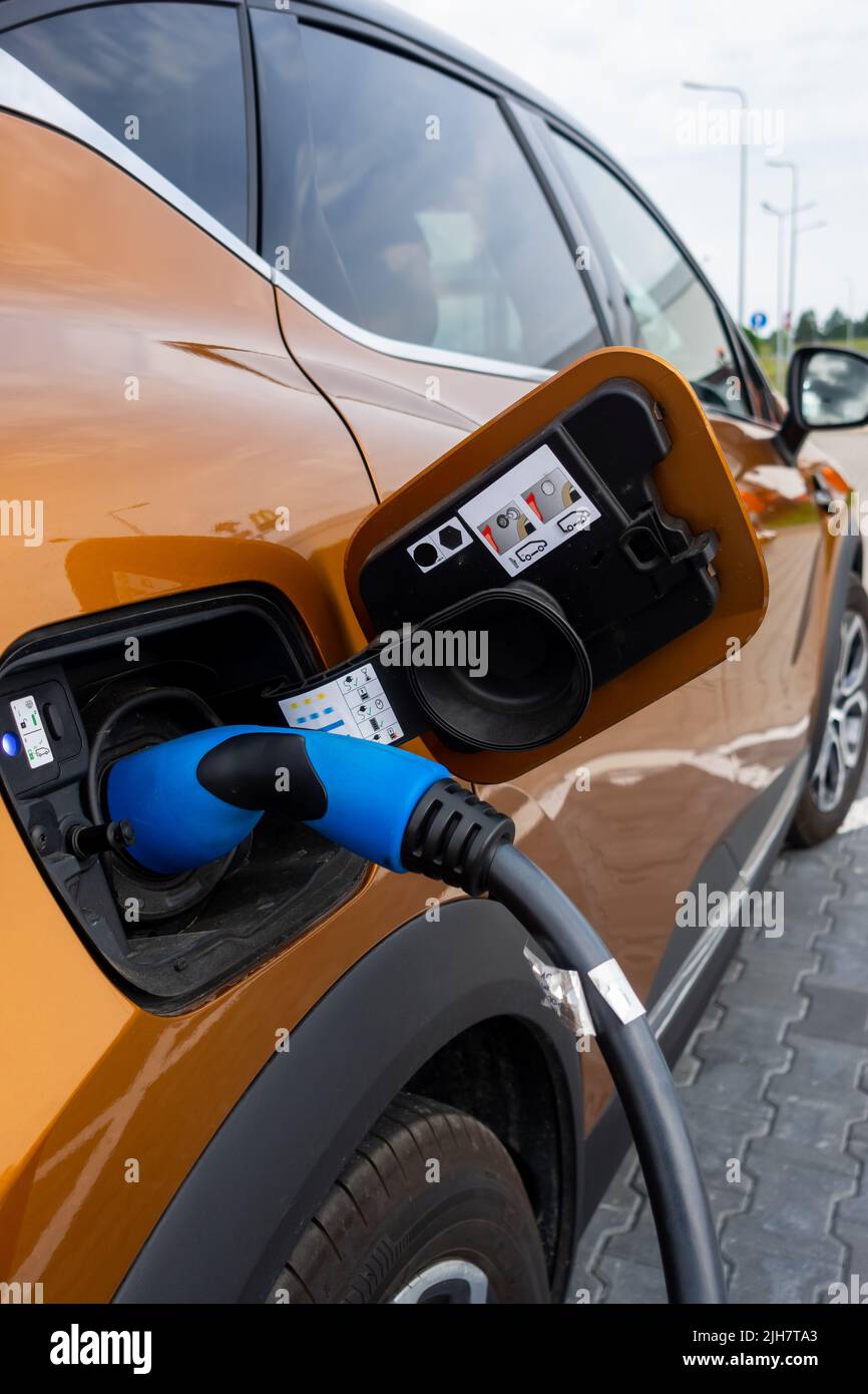 Close up for the socket of the electric car during charging. Modern ...