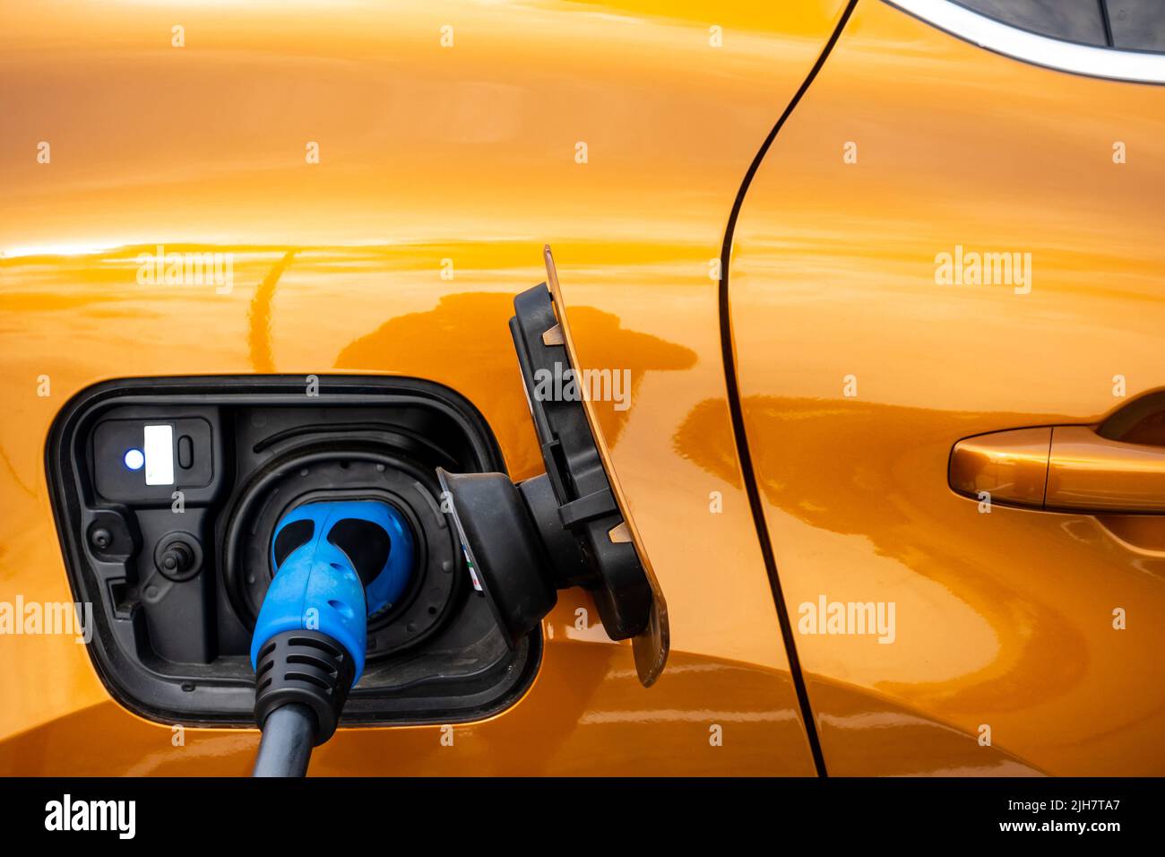 Close up for the socket of the electric car during charging. Modern ...