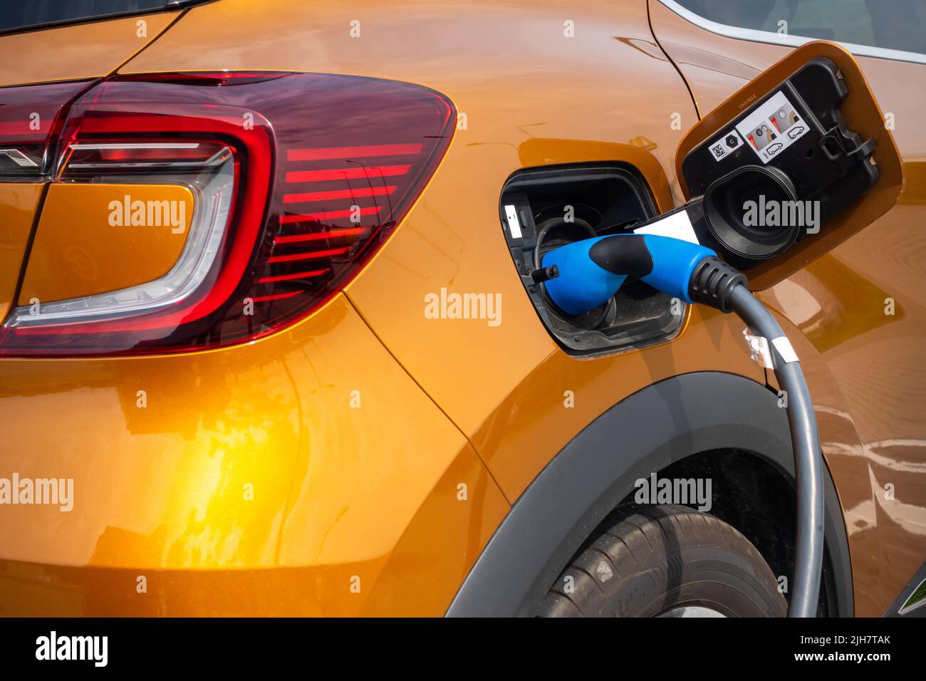 Close up for the socket of the electric car during charging. Modern ...