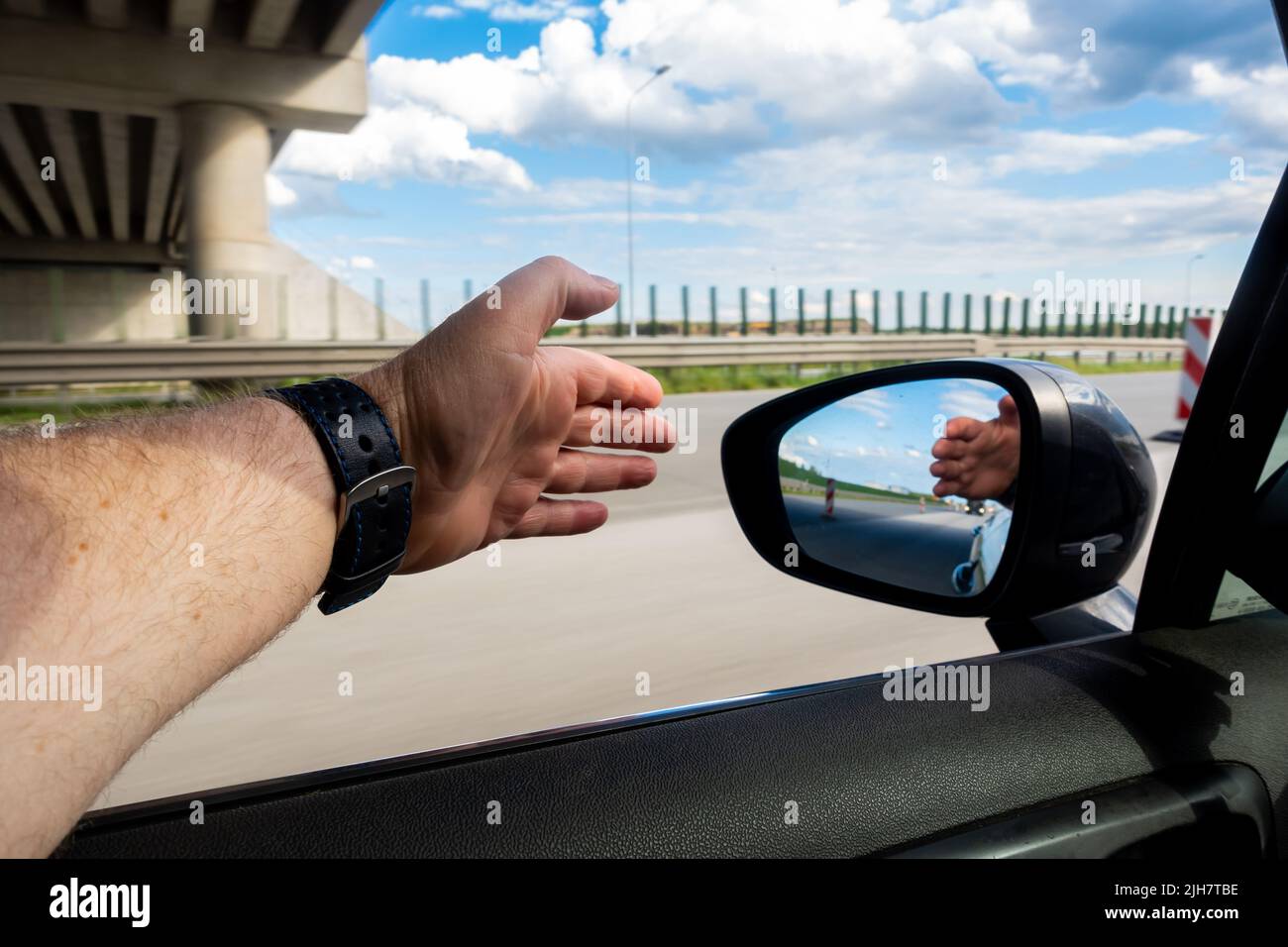 Relaxing car driving with hand outside the vehicle. Photo taken while ...