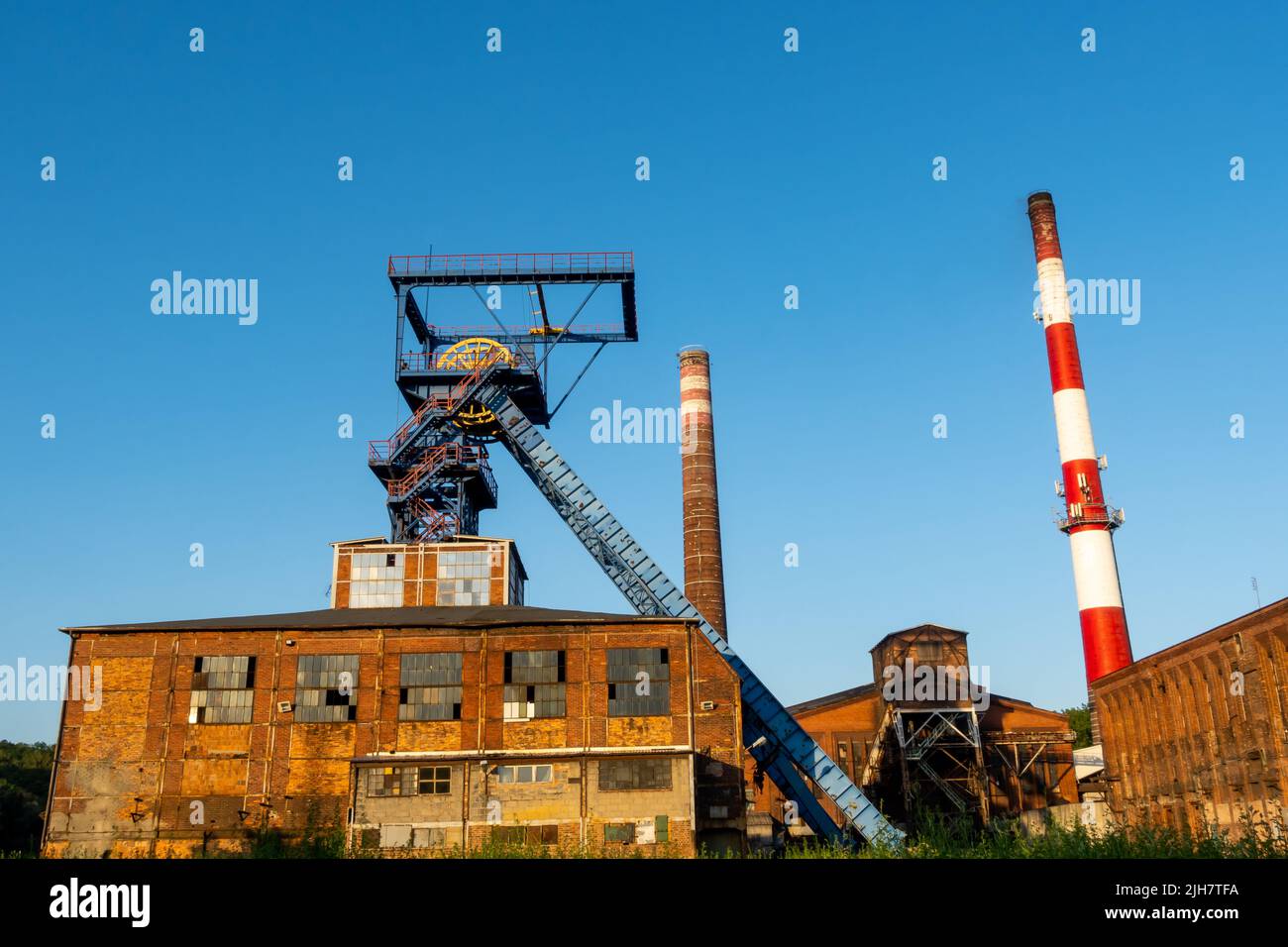 Distant view for the shaft tower of a closed black coal mine ...