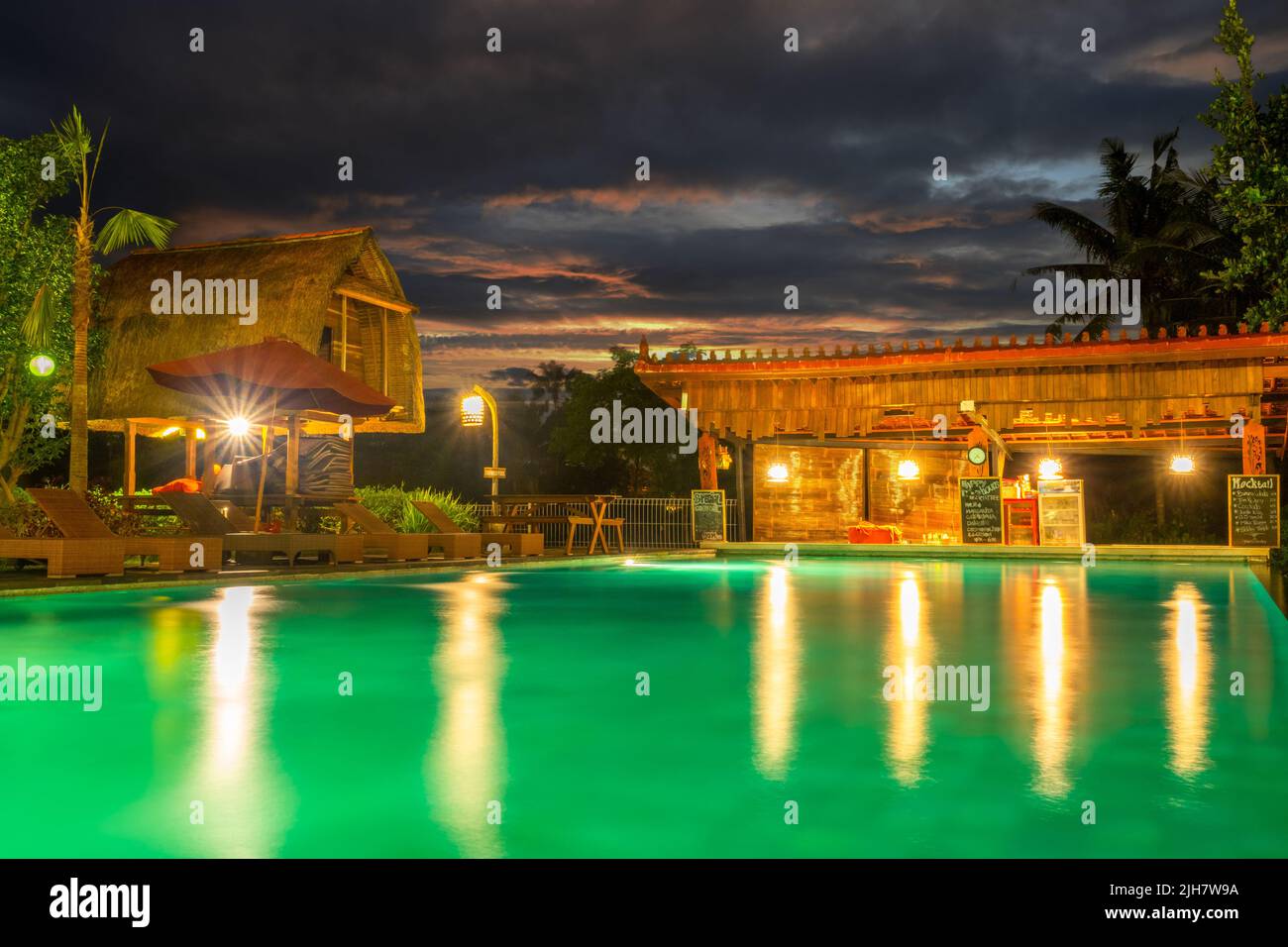 Indonesia. Late evening in the jungle. Empty pool and water bar in the ...