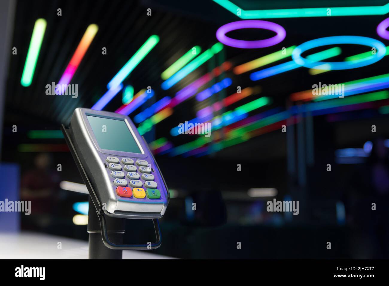 Pos reader sale in front of abstract background in light - equipment ...