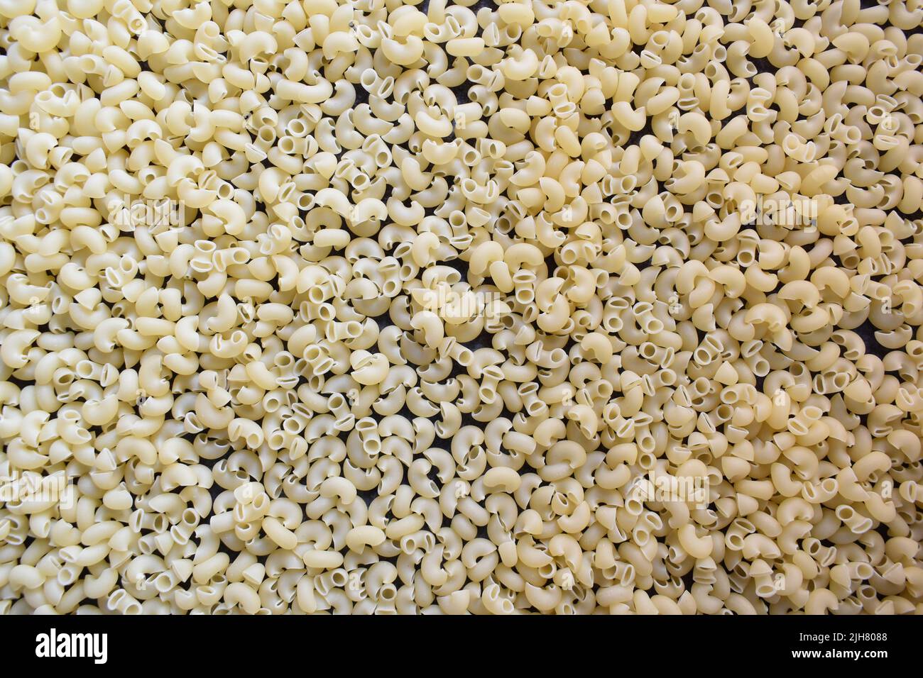 Raw whole dried Macaroni pasta Stock Photo - Alamy