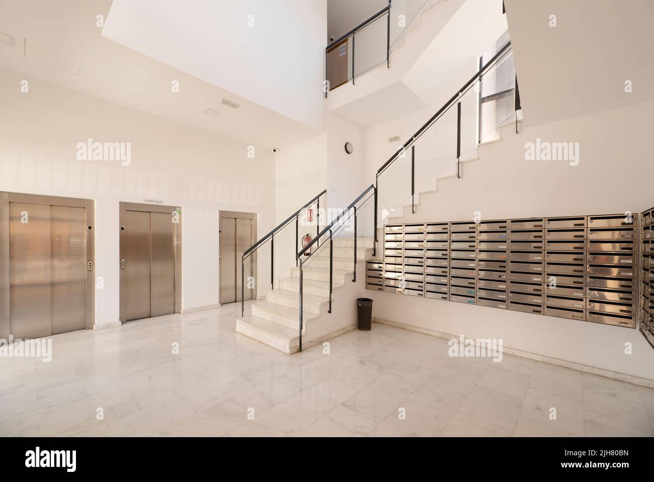Lobby of a building with an atrium, stairs with metal and glass ...