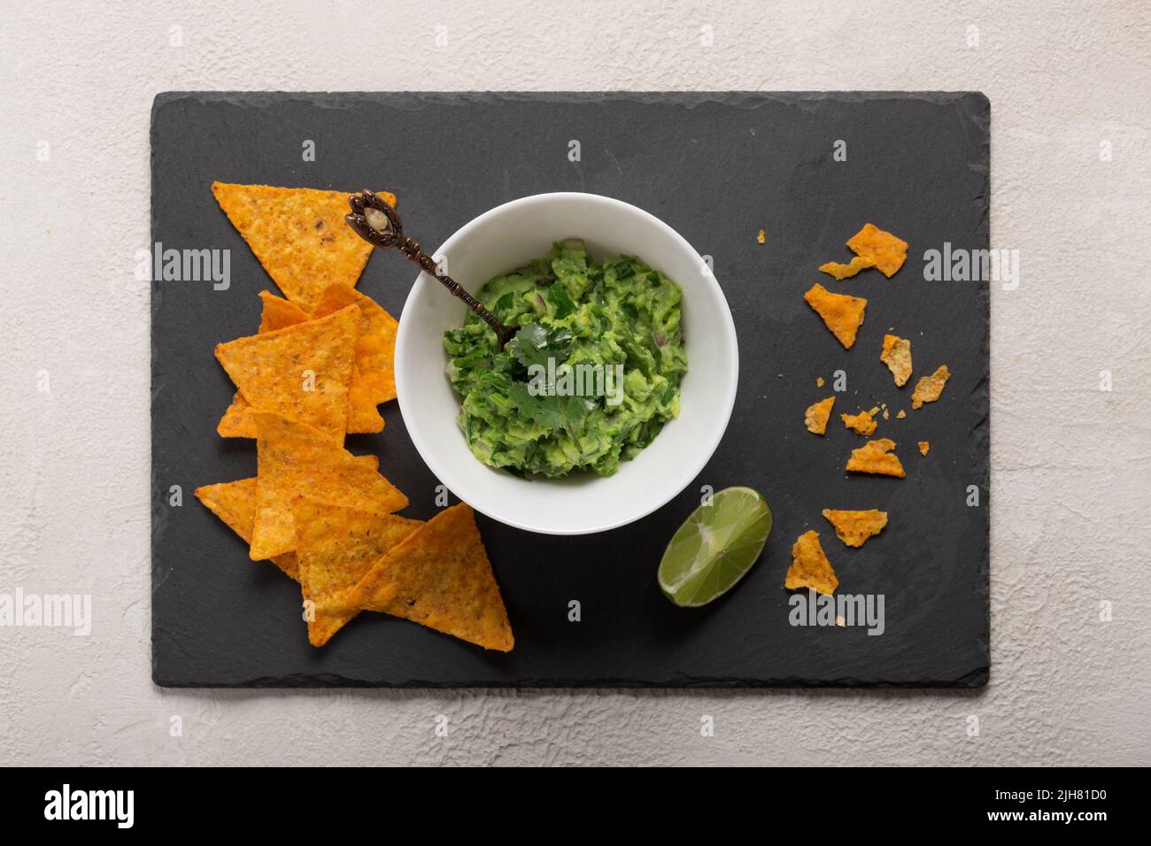 Latinamerican Mexican food party sauce guacamole, salsa, chips, and t ...