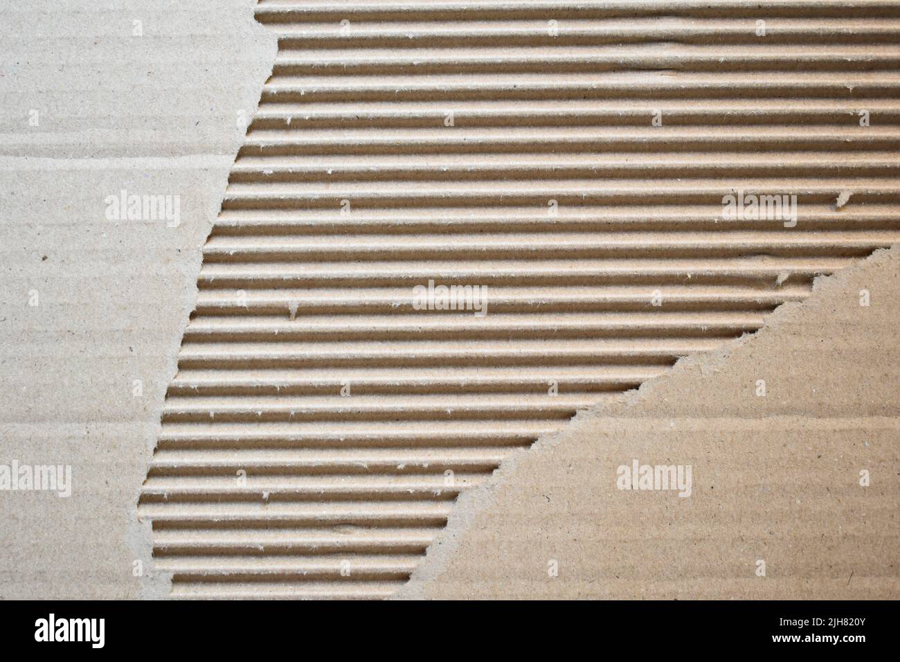 Light brown color ripped cardboard textured background Stock Photo - Alamy