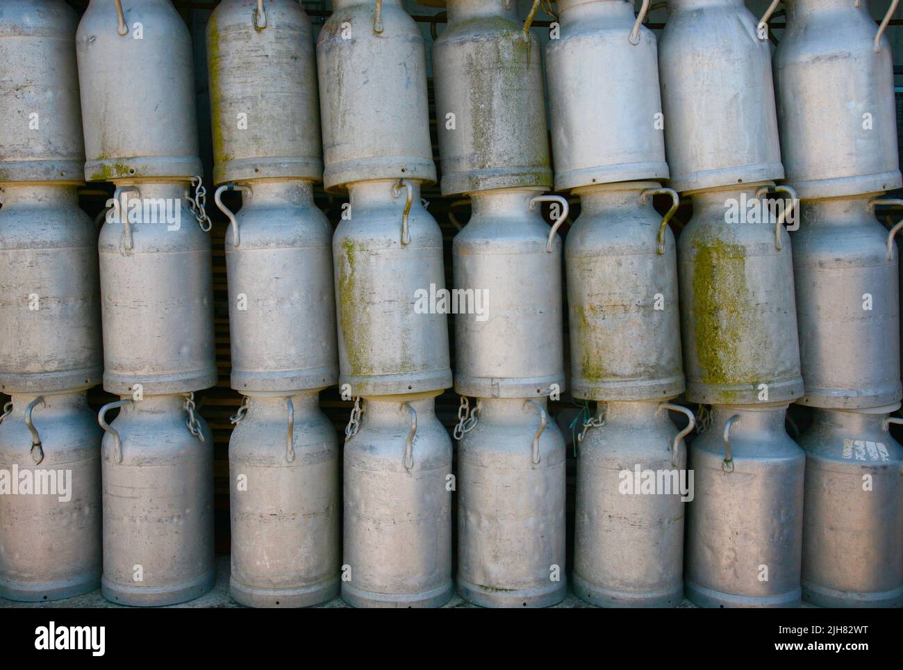 A huge stack of milk churns in the French countryside Stock Photo - Alamy