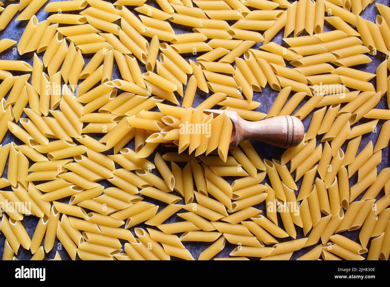 Whole dried Penne rigate pasta Stock Photo - Alamy