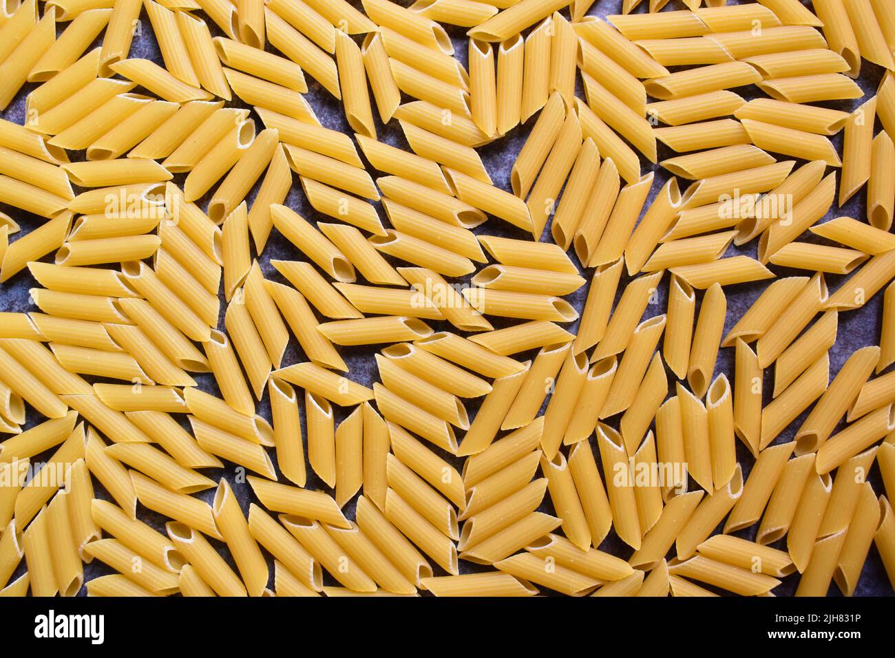 Whole dried Penne rigate pasta Stock Photo - Alamy
