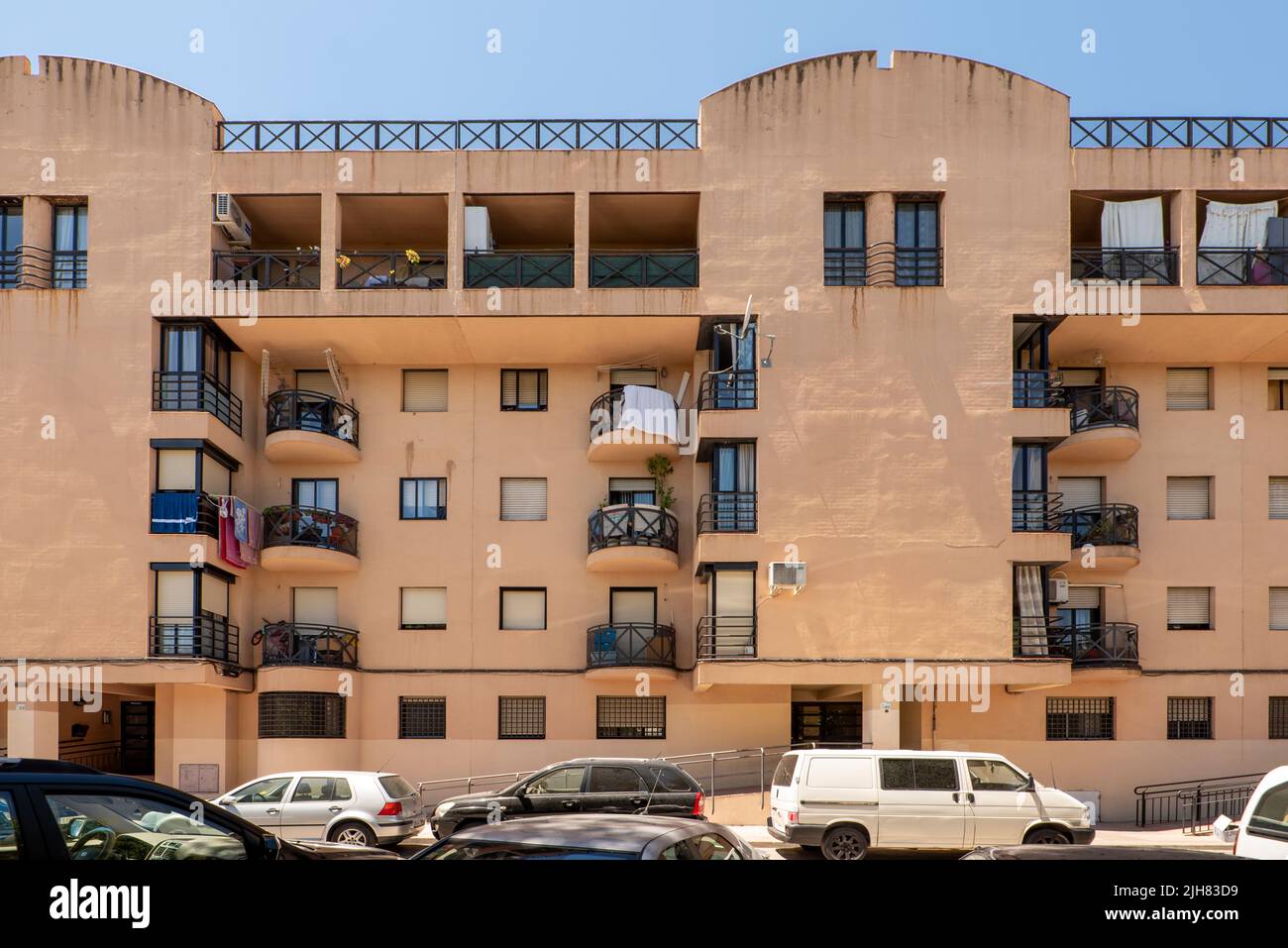 Facades of urban residential houses painted clay vanilla color and ...