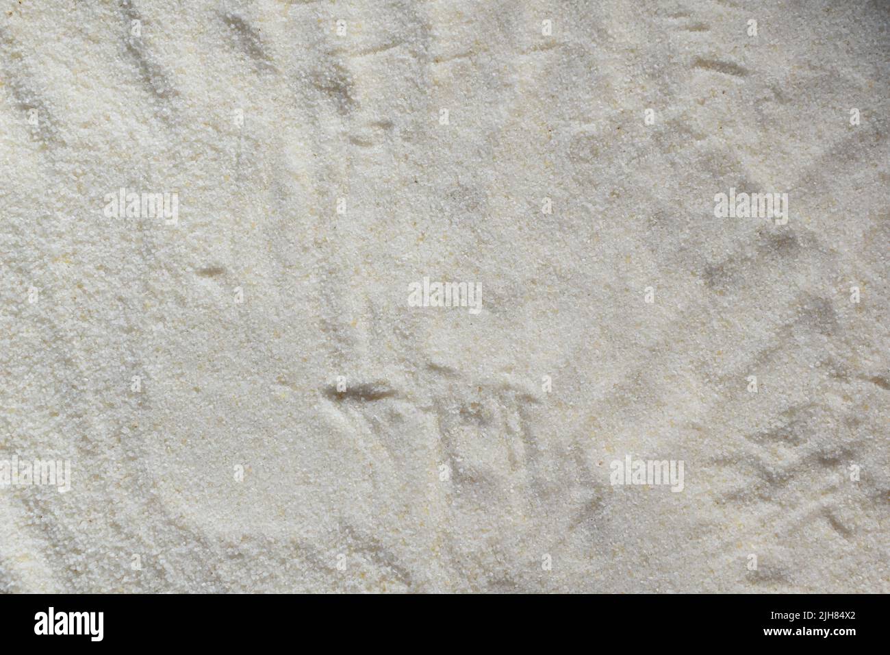 Raw dry rice semolina grains Stock Photo - Alamy