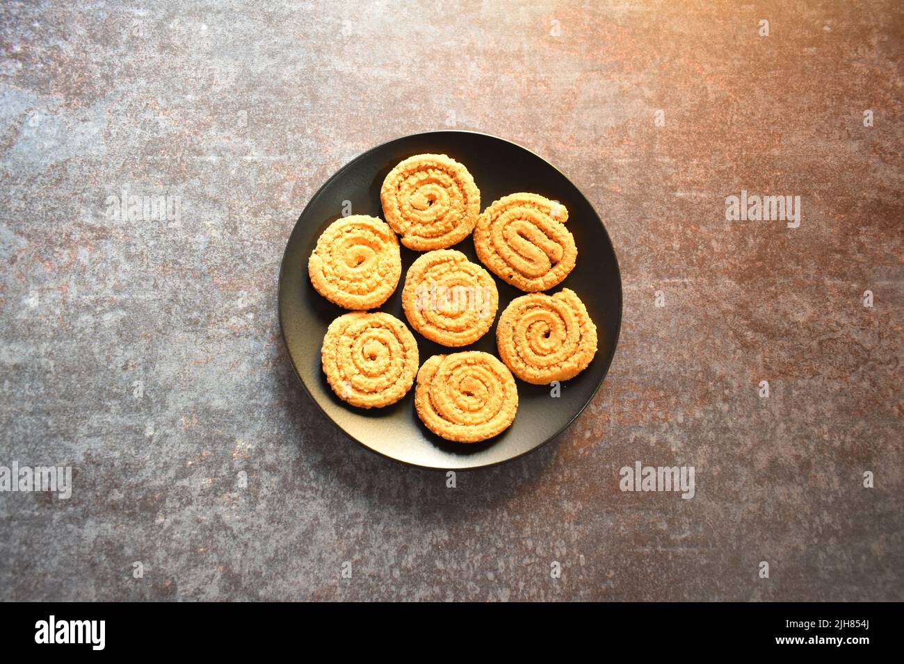 Chakli fried Indian traditional savory snack food Stock Photo - Alamy