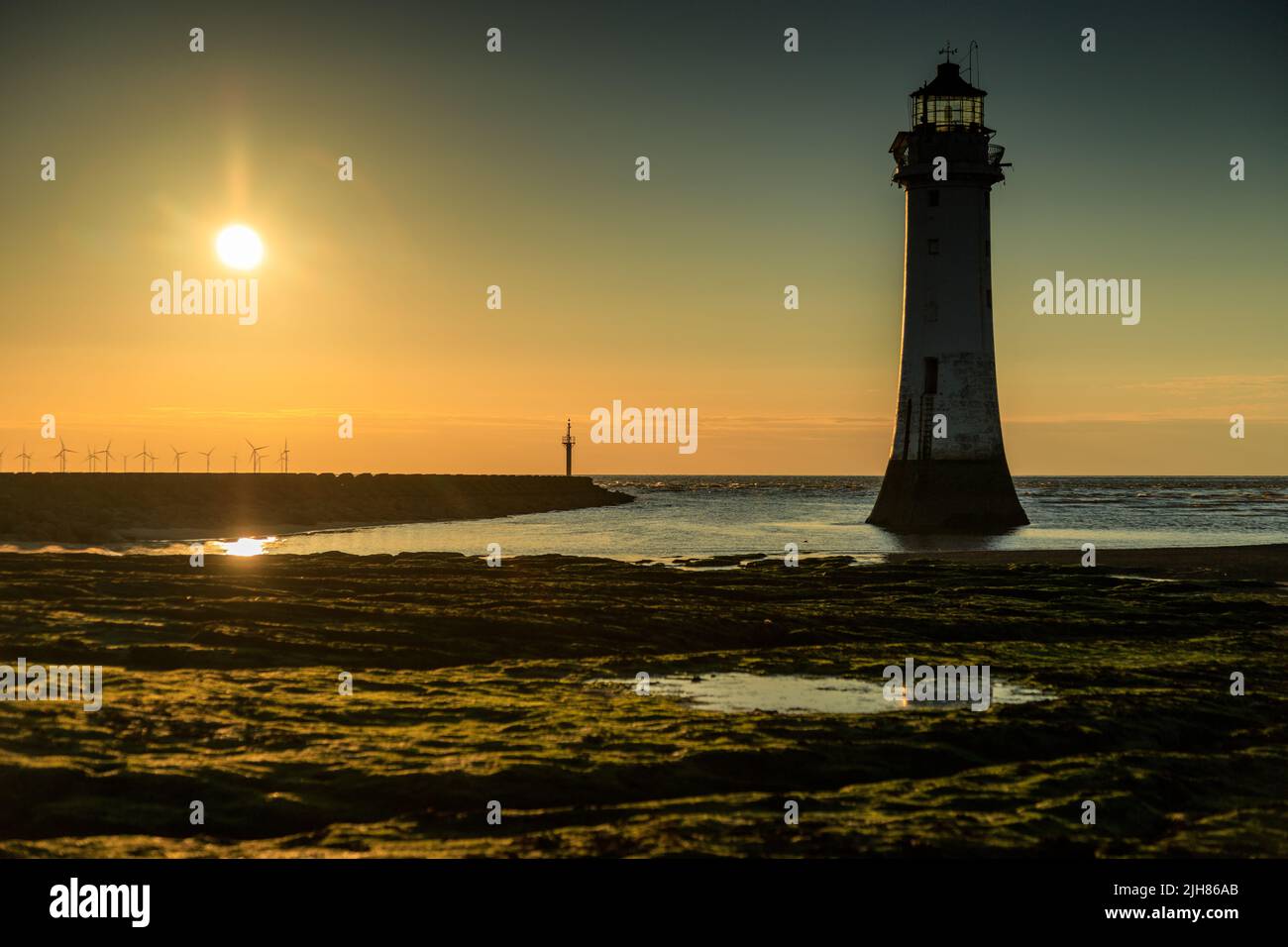 Sunset over the lighthouse at new Brighton, Wirral, Merseyside, England ...