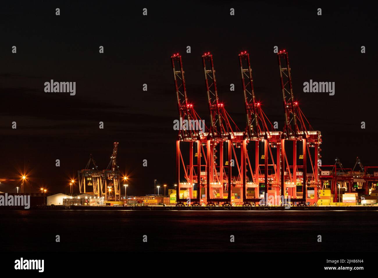 Red cranes at night at Liverpool 2 Container terminal, England Stock ...