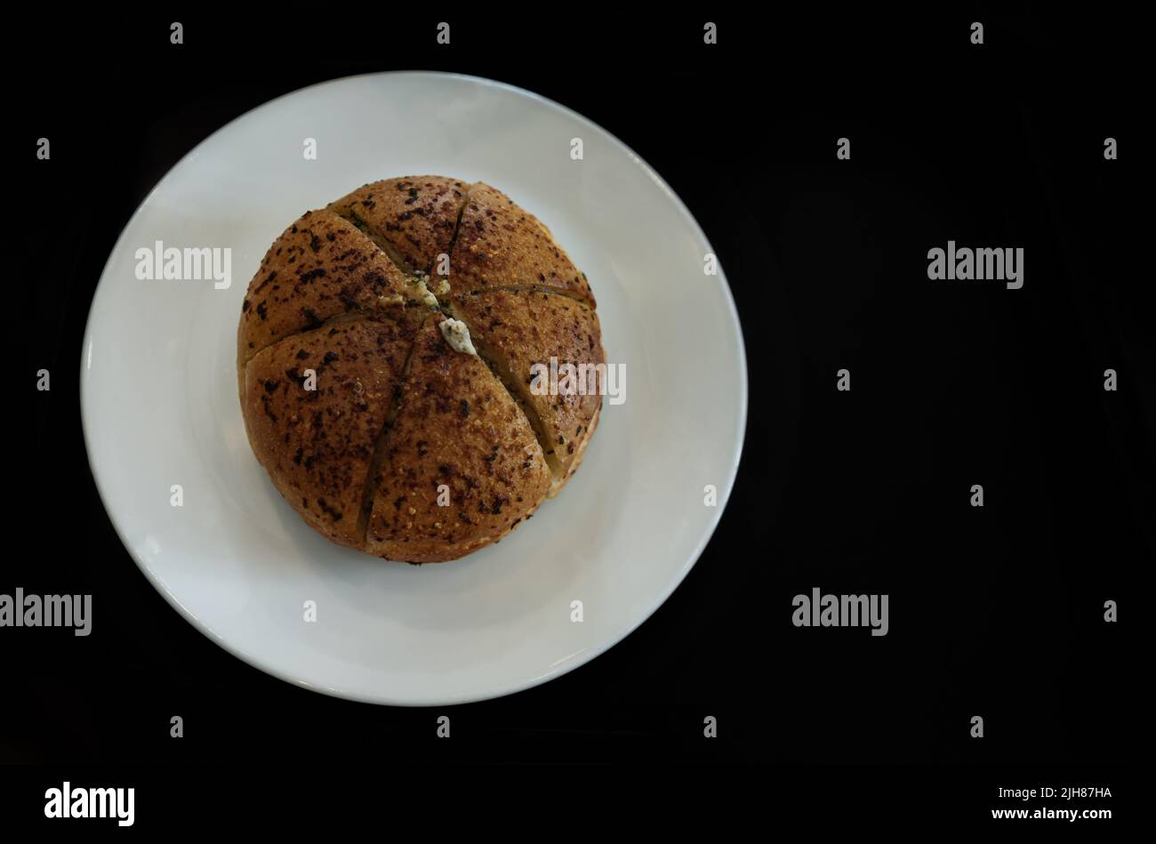 Homemade Truffle Cream Cheese Bun on white ceramic plate in black ...