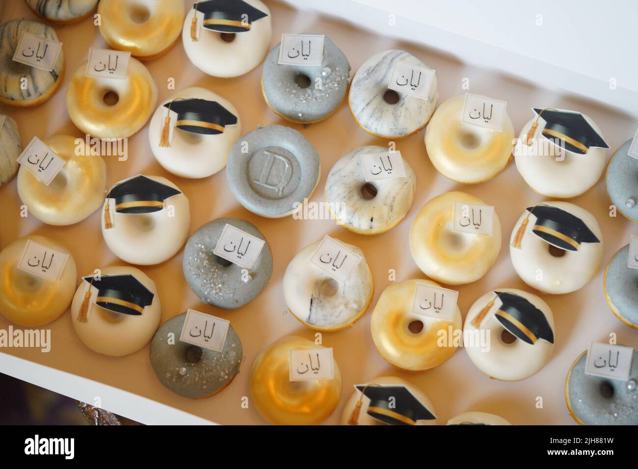 Graduation mini doughnuts for catering Stock Photo - Alamy