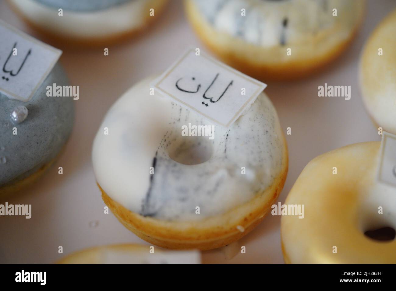 Graduation mini doughnuts for catering Stock Photo - Alamy