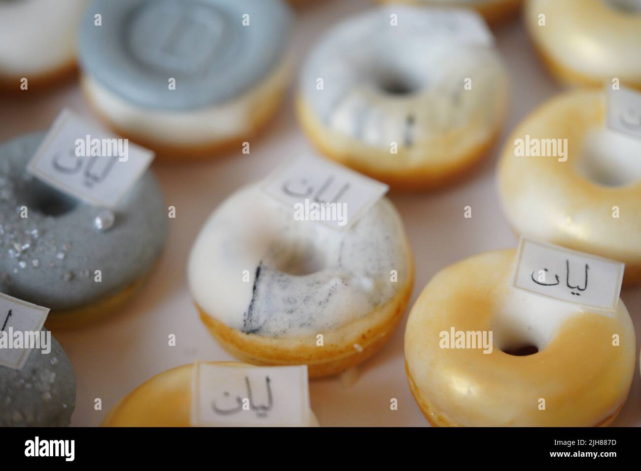 Graduation mini doughnuts for catering Stock Photo - Alamy