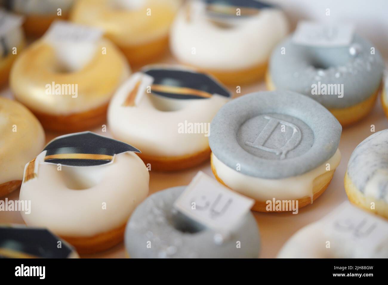 Graduation mini doughnuts for catering Stock Photo - Alamy