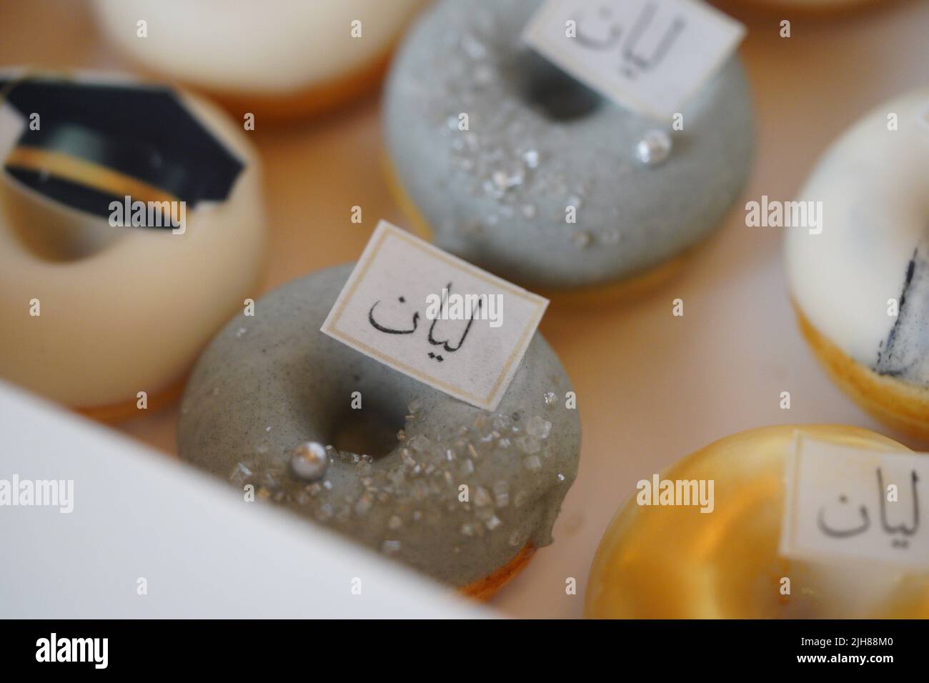 Graduation mini doughnuts for catering Stock Photo - Alamy