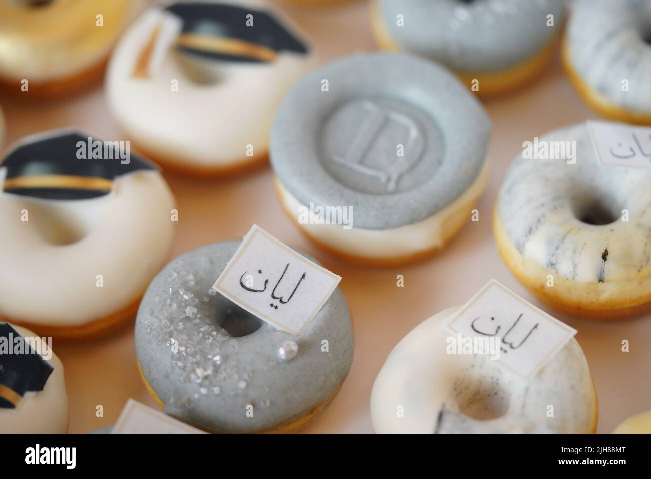 Graduation mini doughnuts for catering Stock Photo - Alamy