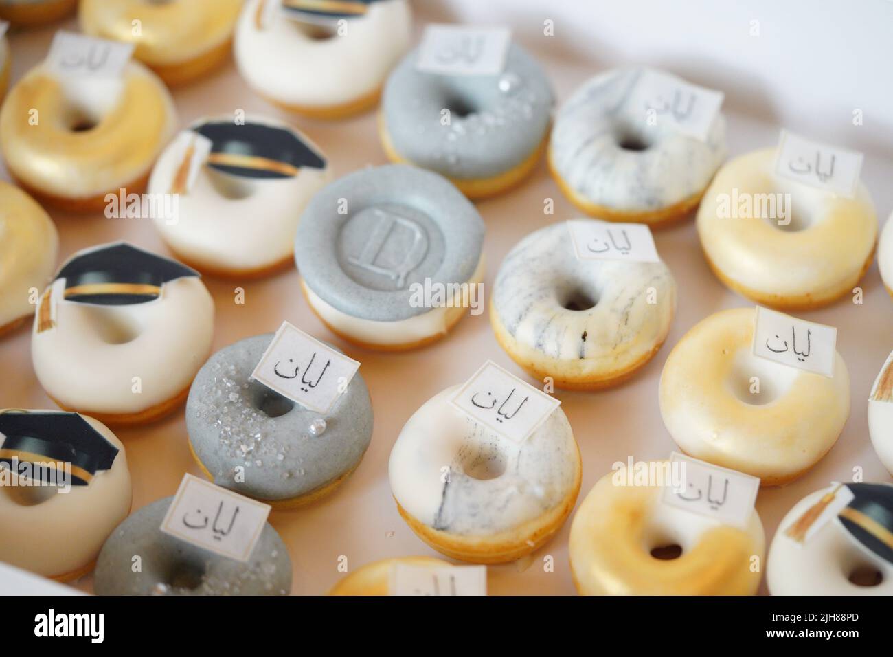 Graduation mini doughnuts for catering Stock Photo - Alamy