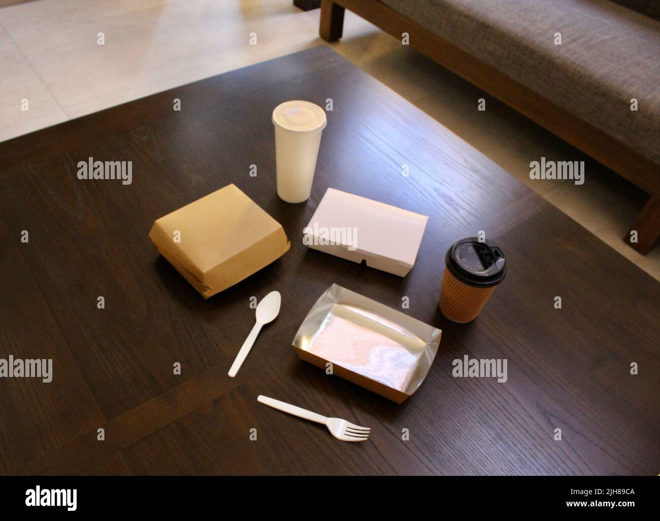 Disposable paper food packaging and plastic cutlery Stock Photo - Alamy