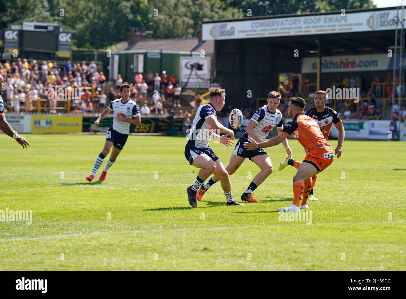 Matty Nicholson #35 of Warrington Wolves looks to feed the ball to ...