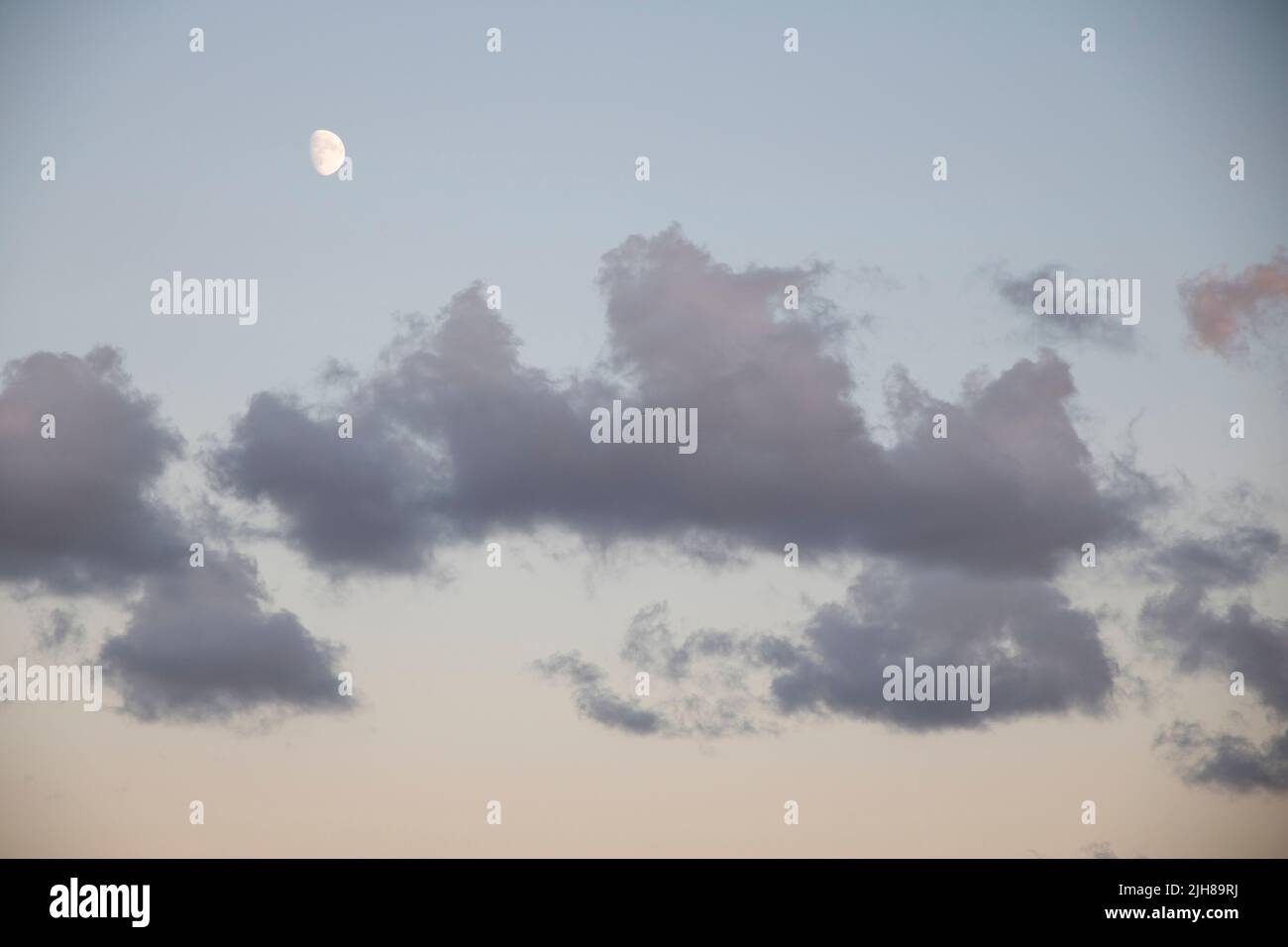 Clouds during sunset on a beach Stock Photo - Alamy