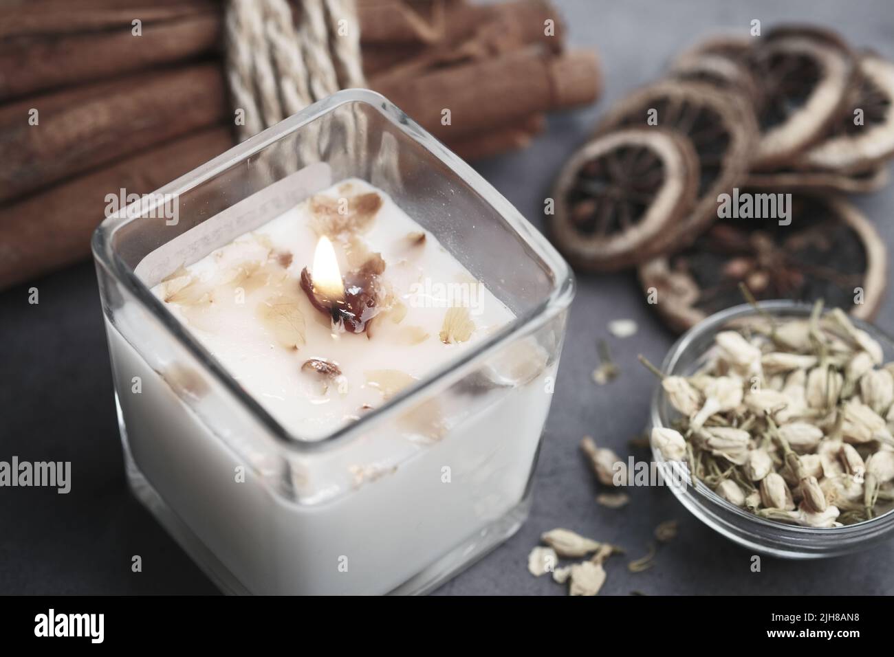 Burning scented candles for relax on black background Stock Photo - Alamy
