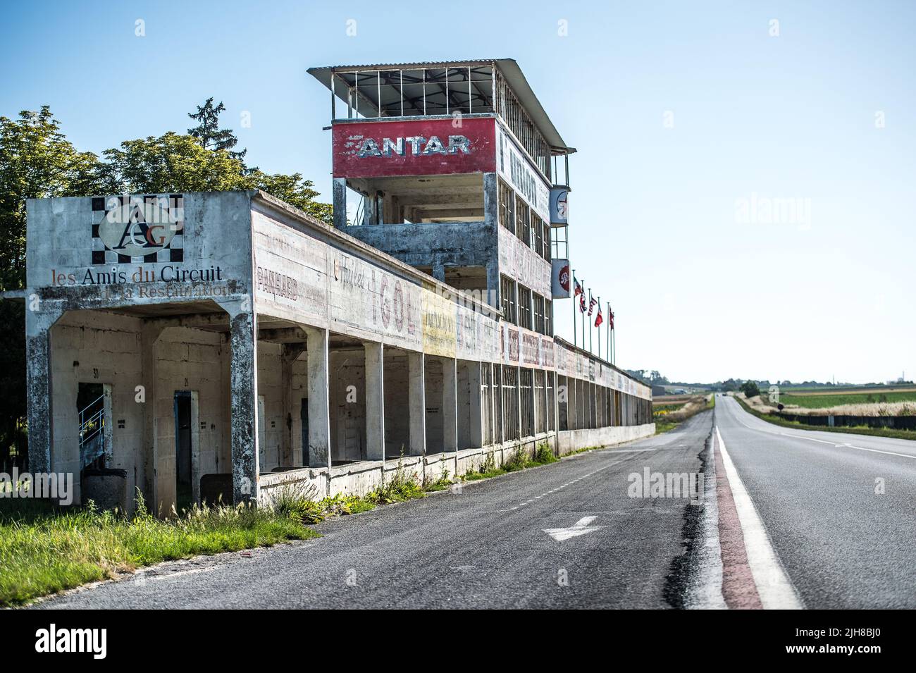 Old buildings, pit lane & grandstand of the abandoned race circuit ...
