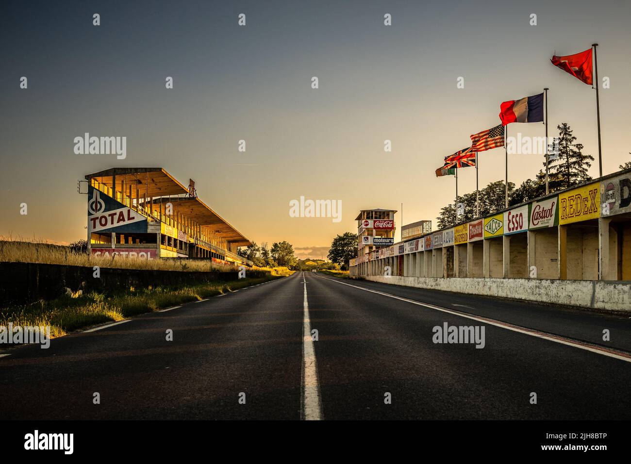 Old buildings, pit lane & grandstand of the abandoned race circuit ...