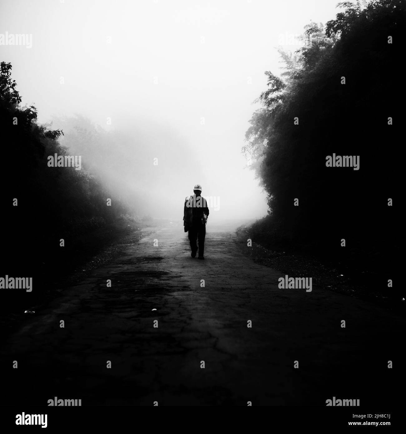 A creepy man walking on the road Stock Photo - Alamy