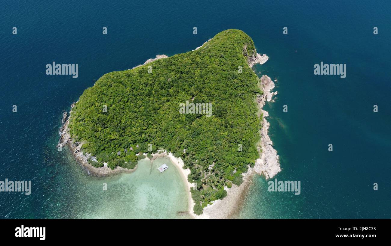 An aerial view of an island covered with green foliage Stock Photo - Alamy