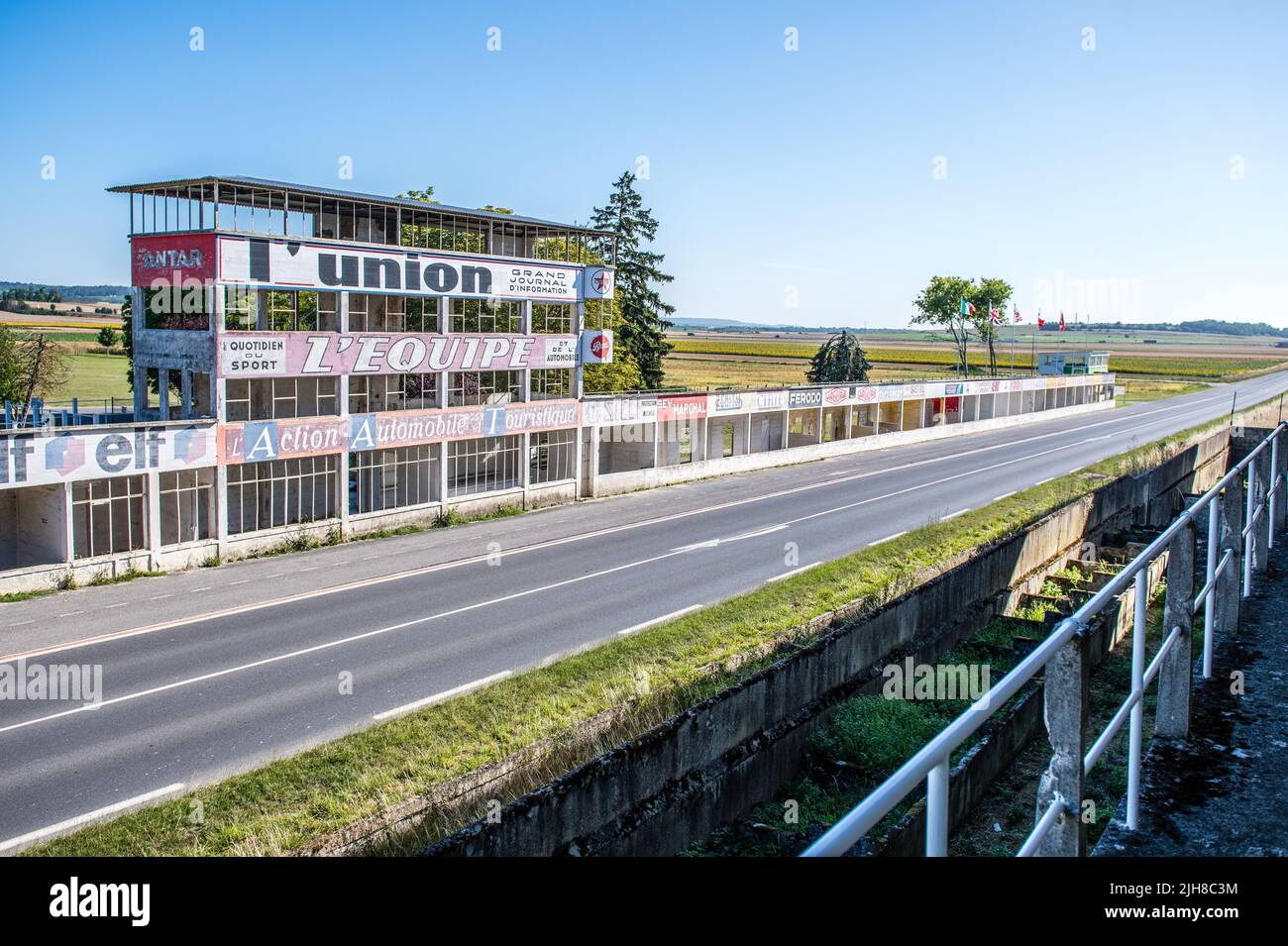 Old buildings, pit lane & grandstand of the abandoned race circuit ...