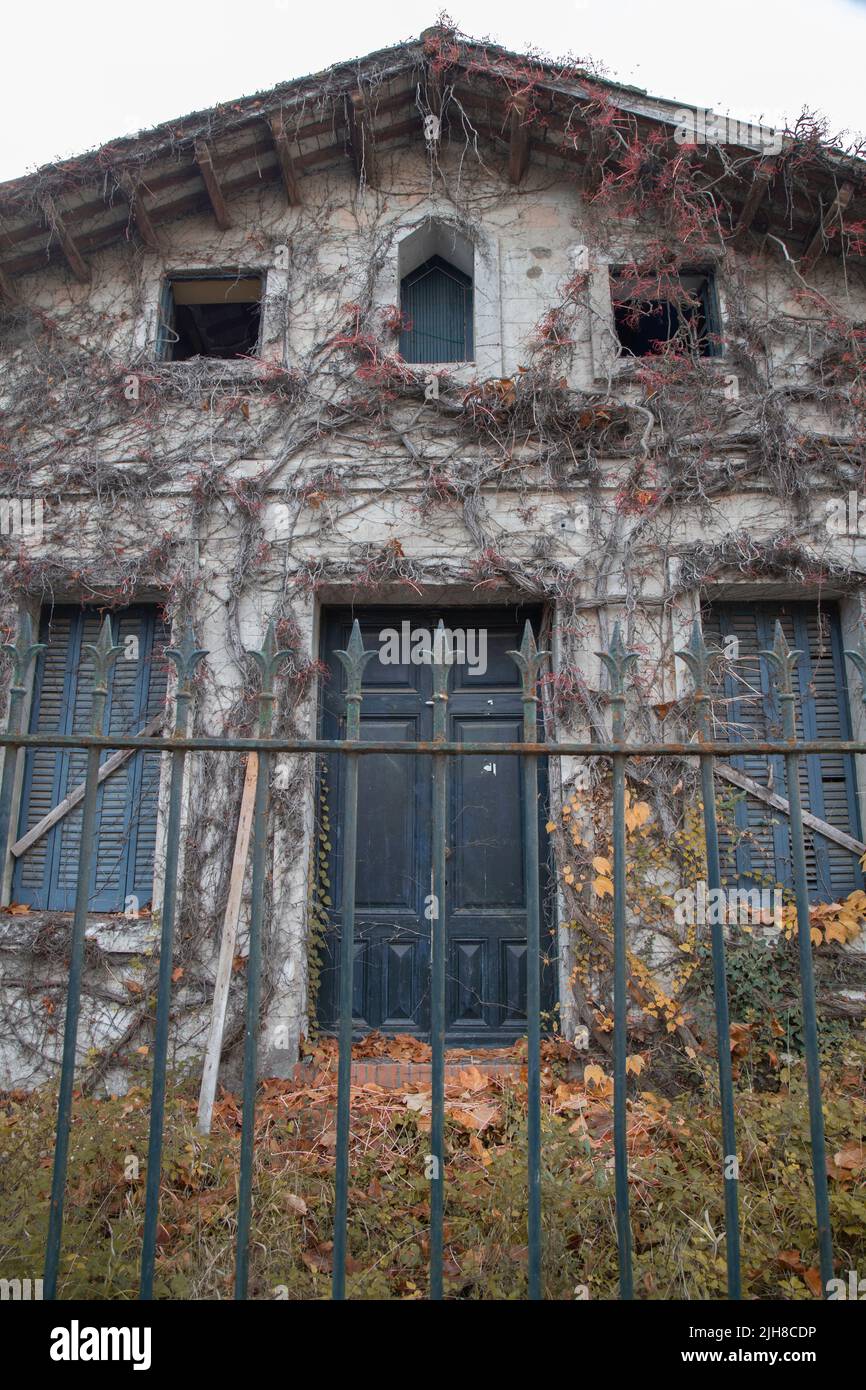 A facade of a creepy abandoned old decay house Stock Photo - Alamy