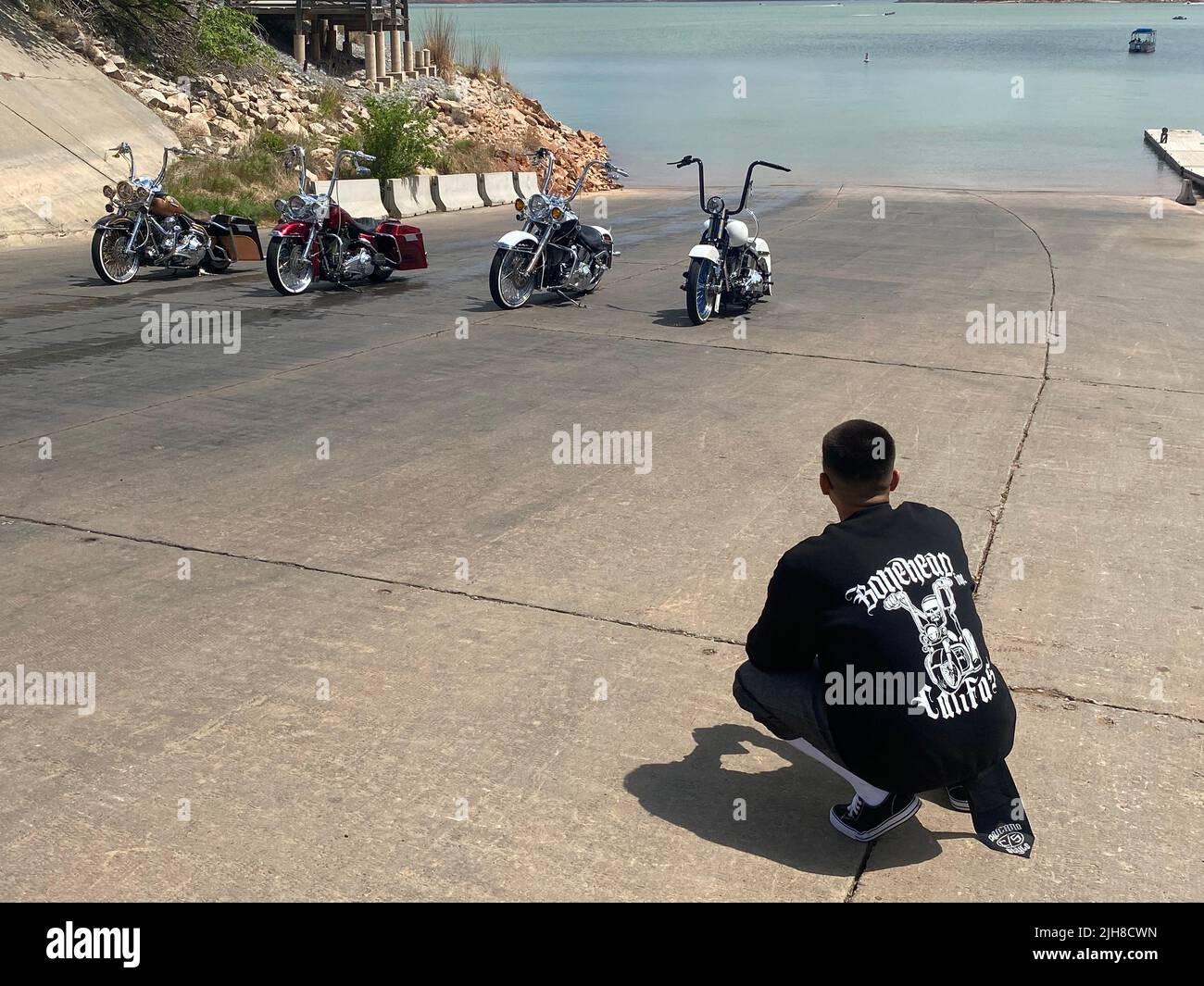A man and a line of motorbikes - wind therapy to the lake Stock Photo ...