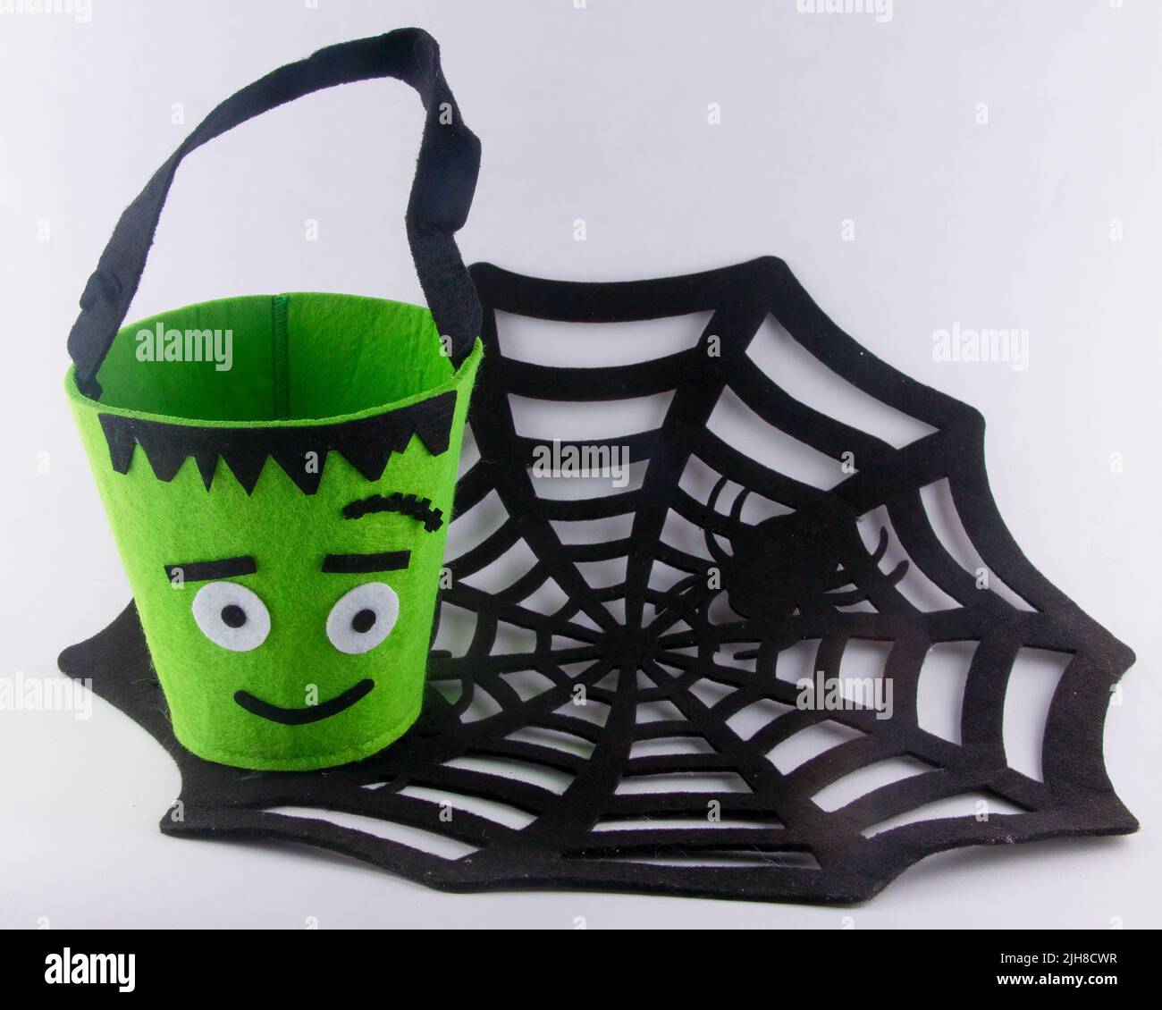 A closeup of the Halloween basket for trick or treat on black spider ...