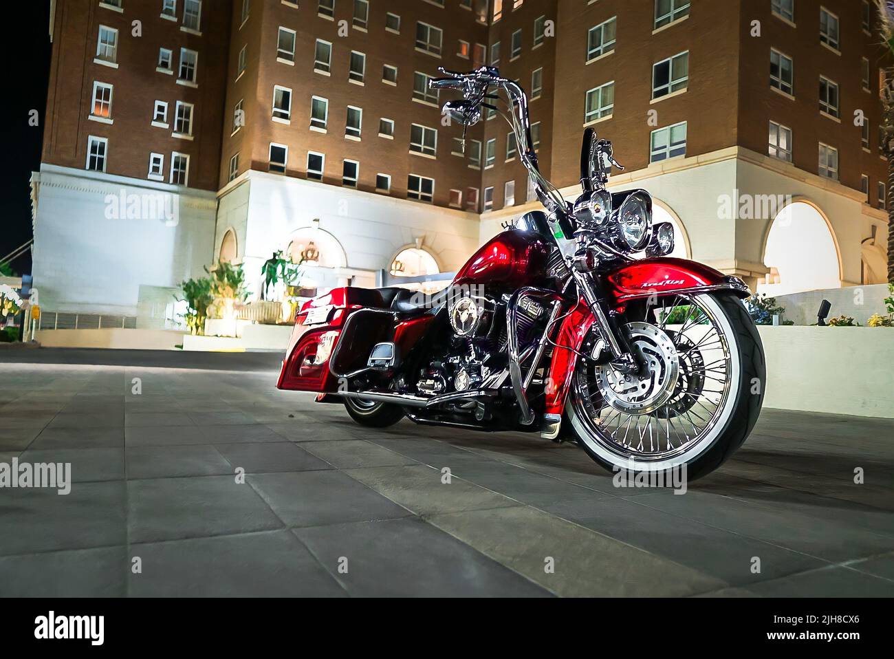 A red Harley Davidson motorbike shining bright at night Stock Photo - Alamy