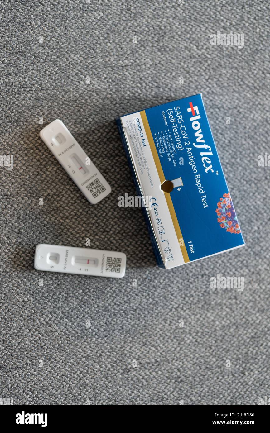 A top view of two Covid-19 rapid tests of Flowflex brand with a barcode ...