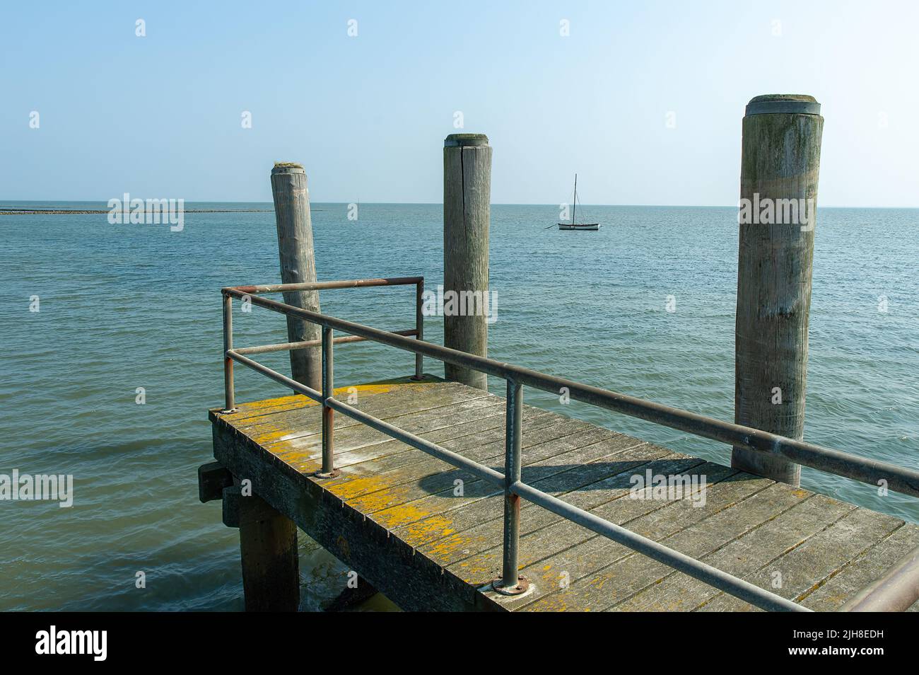 A wooden pier against the background of the North Sea on the island of ...